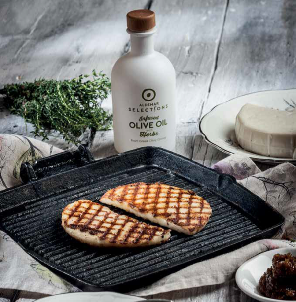 Grilled chios mastelo cheese with fig jam, apaki (smoked pork meat) and ...